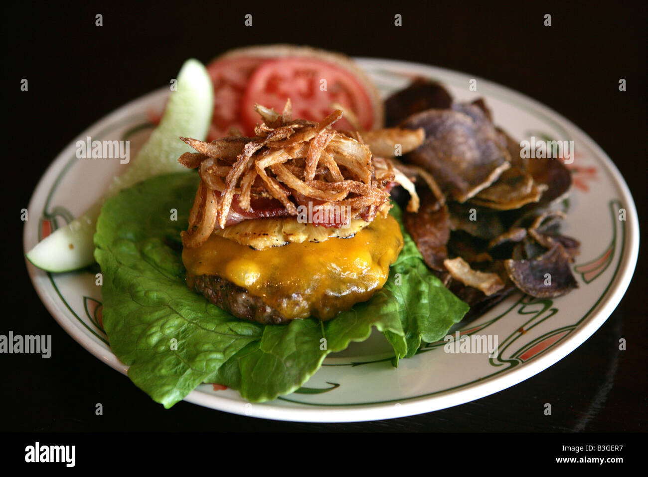 Fancy Cheeseburger with fried onions and Plantain crisps Stock Photo ...