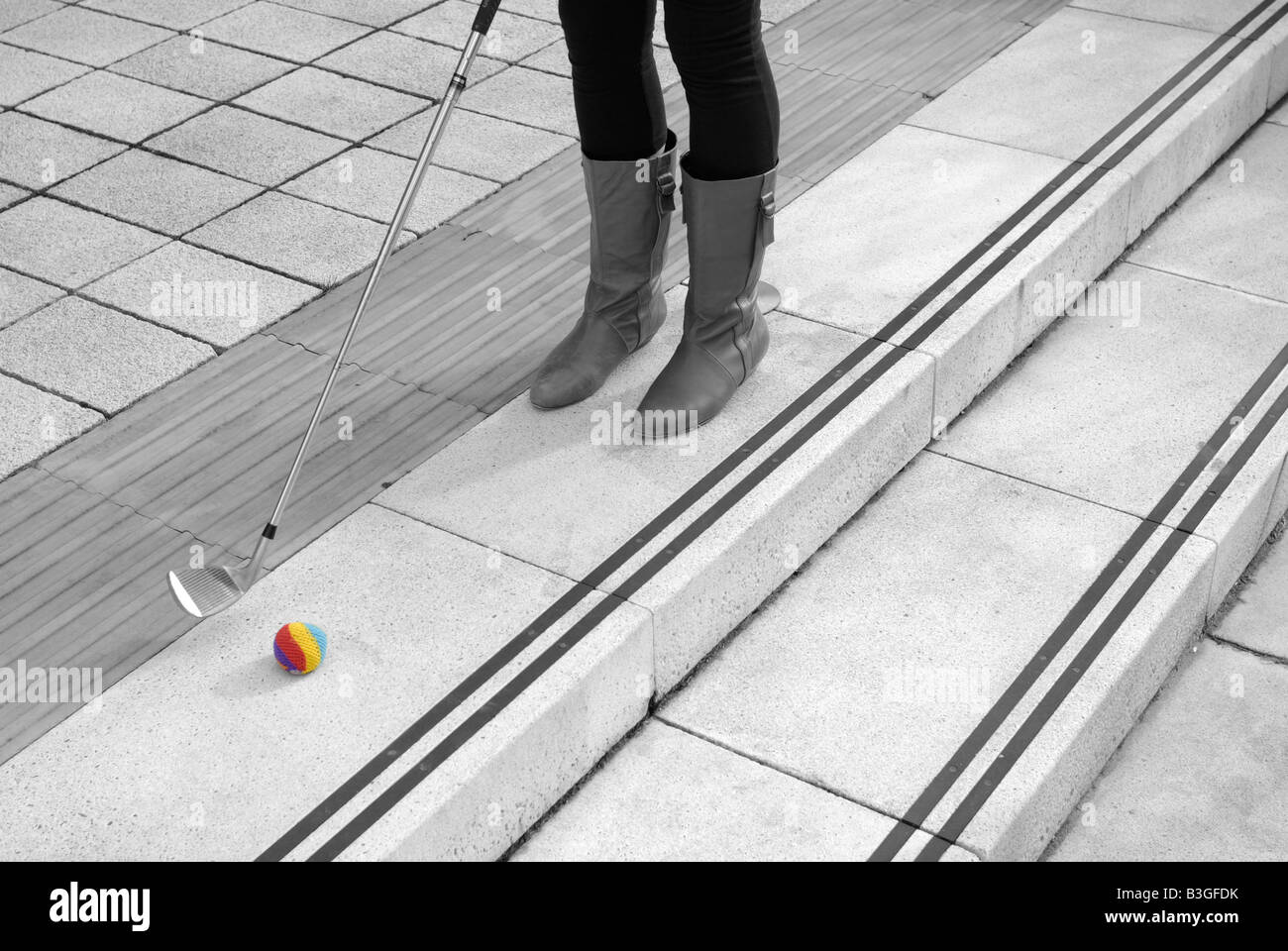 A young woman playing urban golf in the city Stock Photo - Alamy