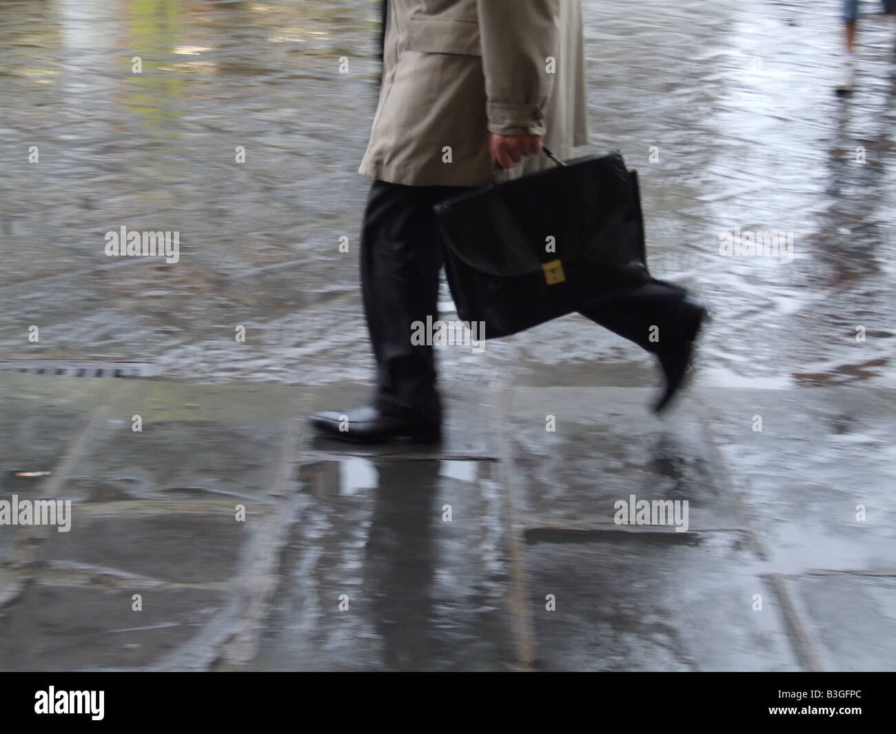 person walking in heavy rain in city town Stock Photo - Alamy