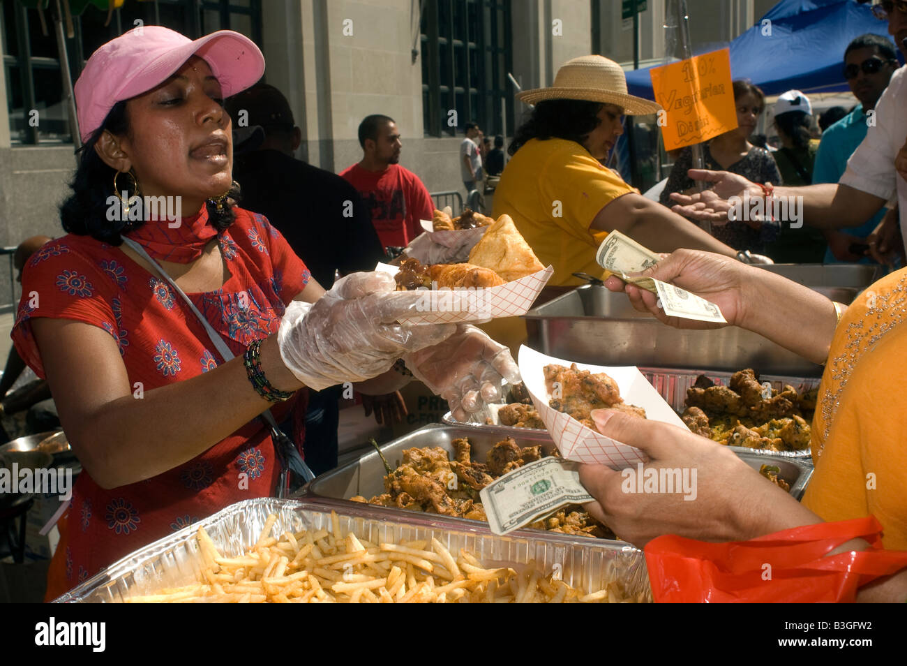 Paradegoers are served authentic Indian food from vendors at the street ...