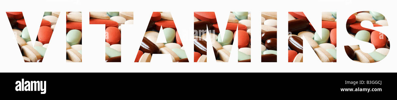 Vitamins background with the letters showing various vitamin tablets ...