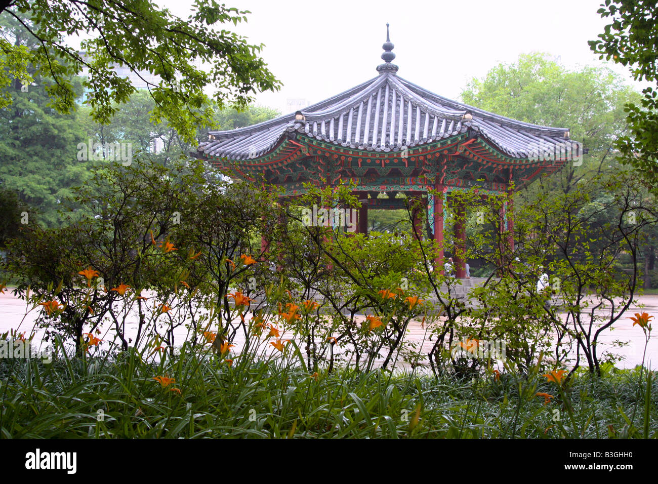 A view of the Tapgol Park in Seoul, Korea. Through flowers and tress a ...