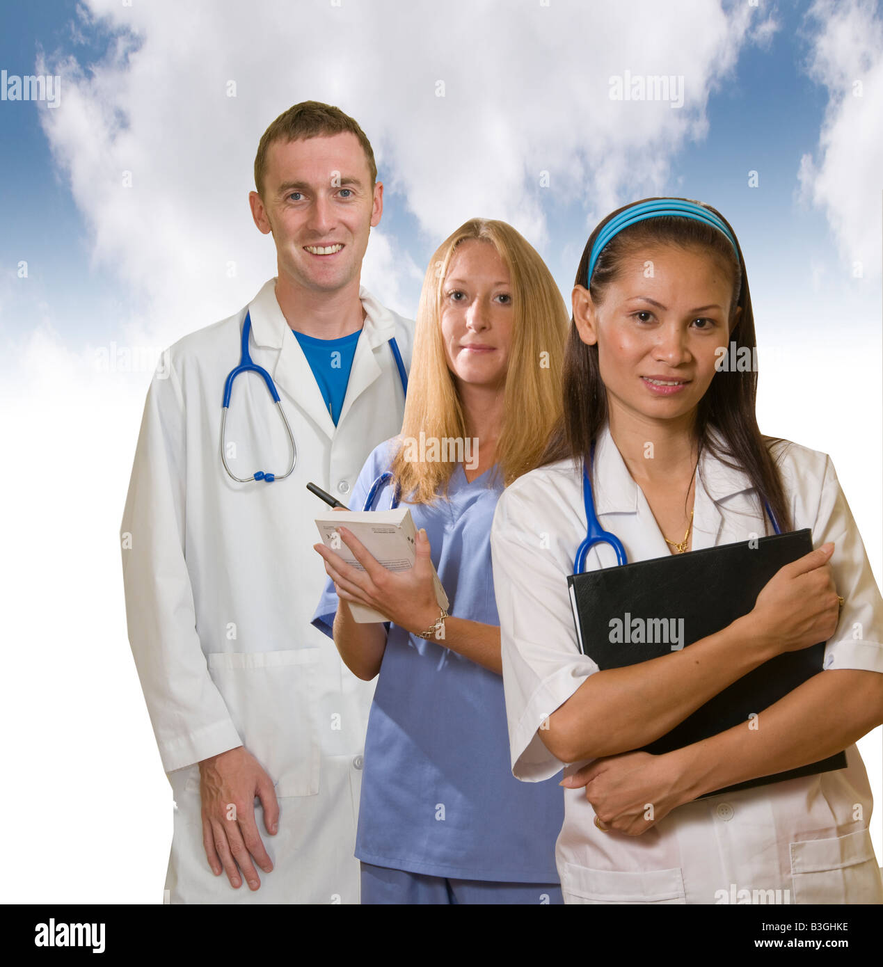 Young Asian and caucasian medical professionals standing together Stock ...