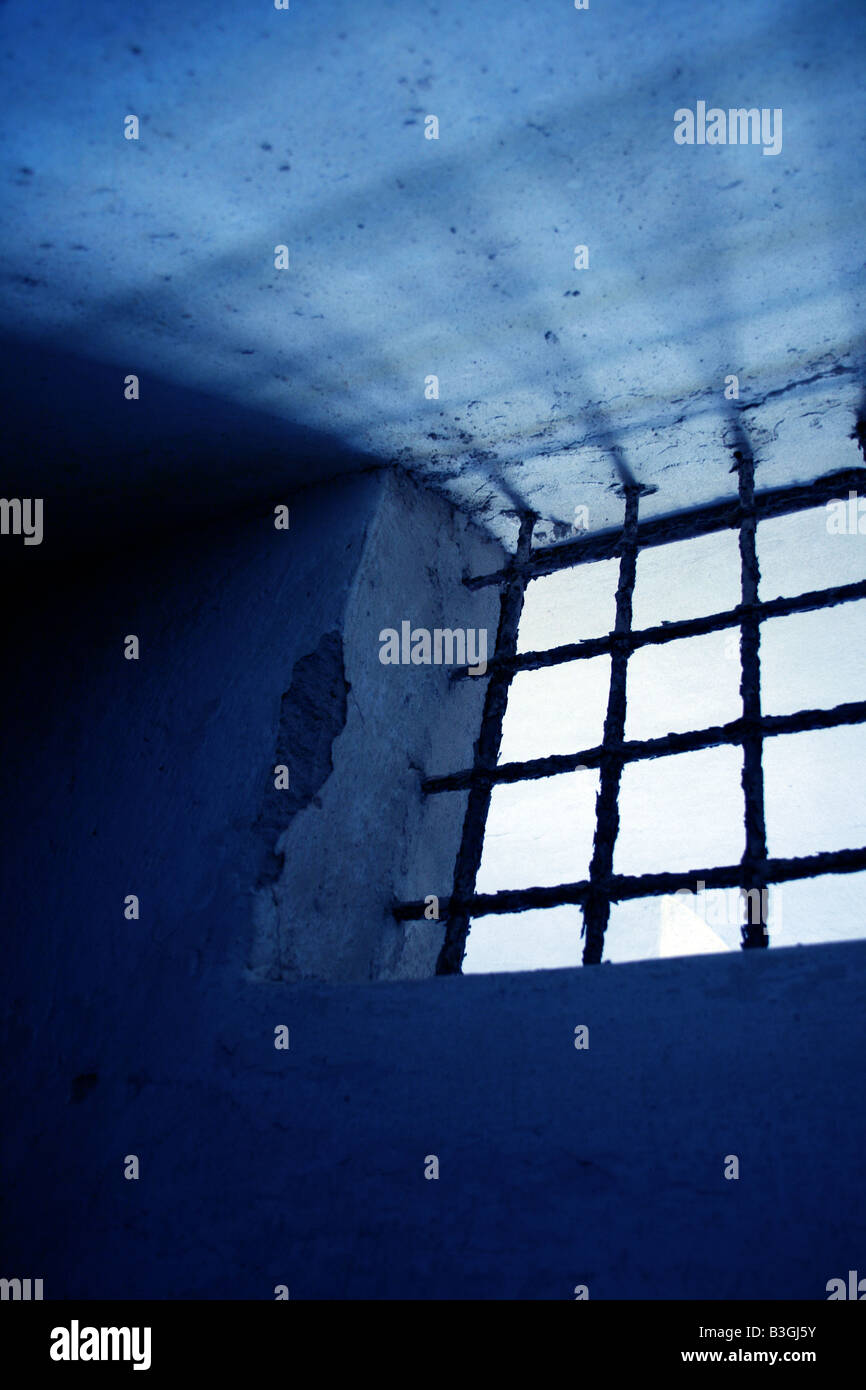 one high dark prison cell window with metal bars Stock Photo - Alamy