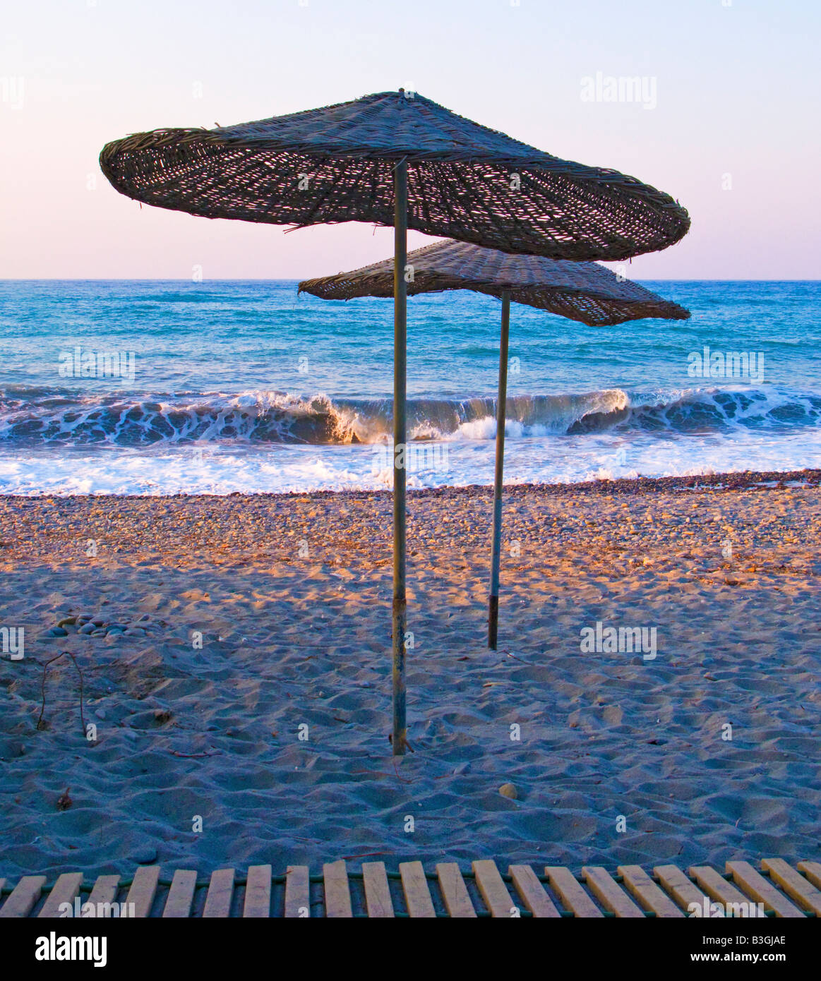 Maleme beach sun shades sunset Crete Stock Photo - Alamy