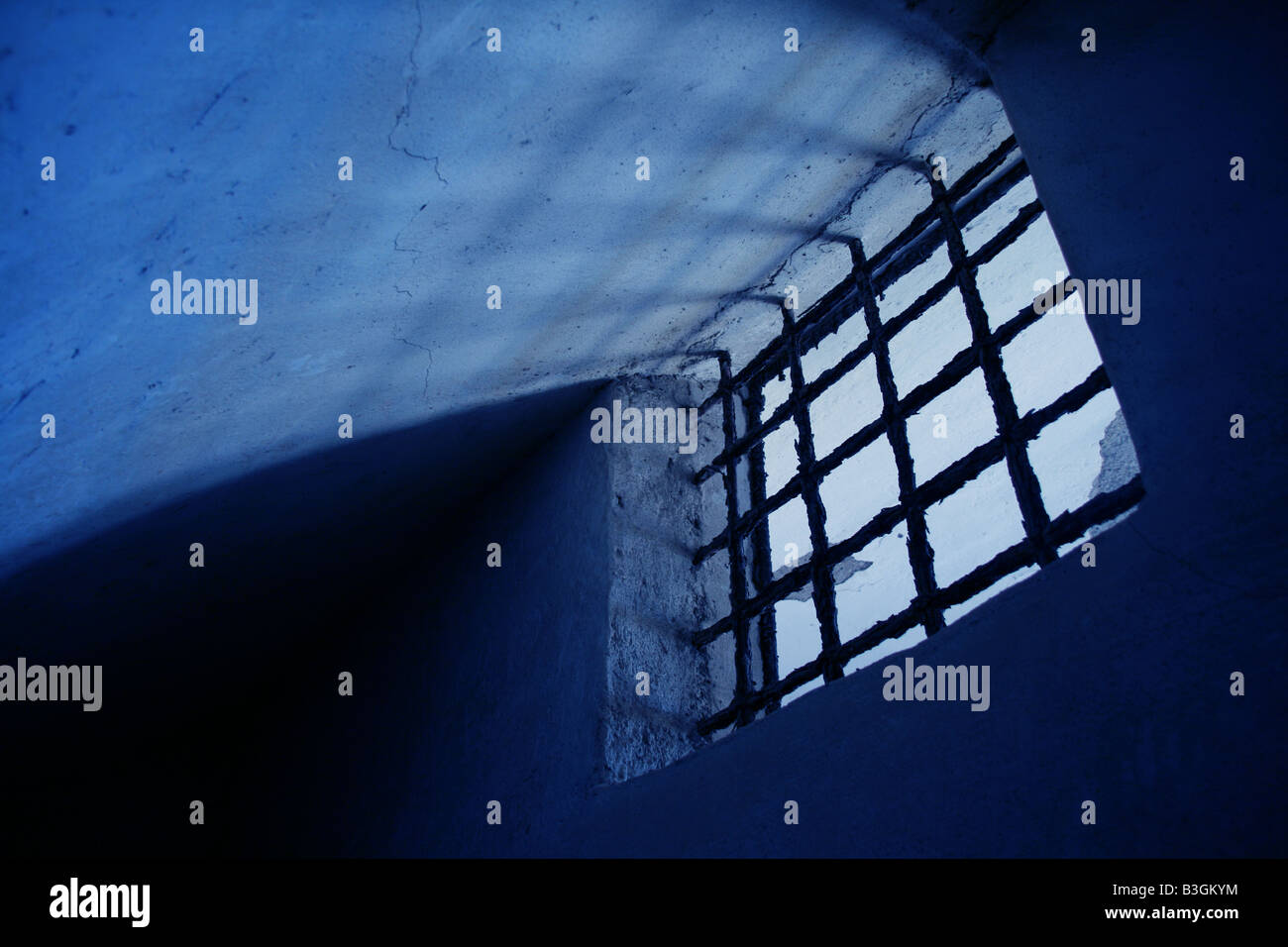 one high dark prison cell window with metal bars Stock Photo - Alamy