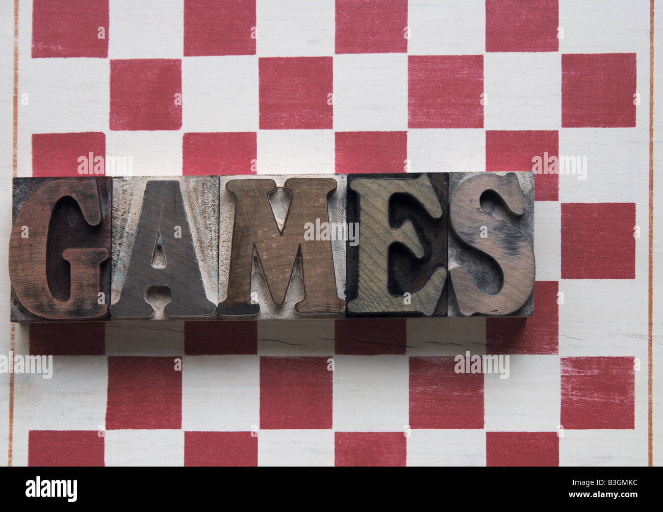 the word 'games' on a red stenciled checkerboard Stock Photo - Alamy
