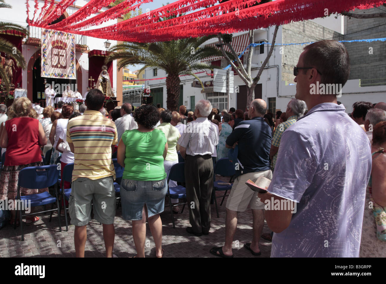 A Catholic mass service outside the church to celebrate the Fiesta of ...