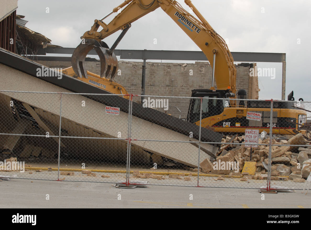 The demolition of a commercial building in the United States Stock ...