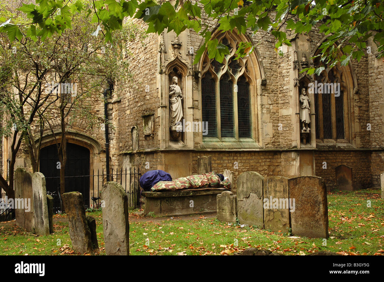 Homeless man sleeping in cemetery hi-res stock photography and images ...
