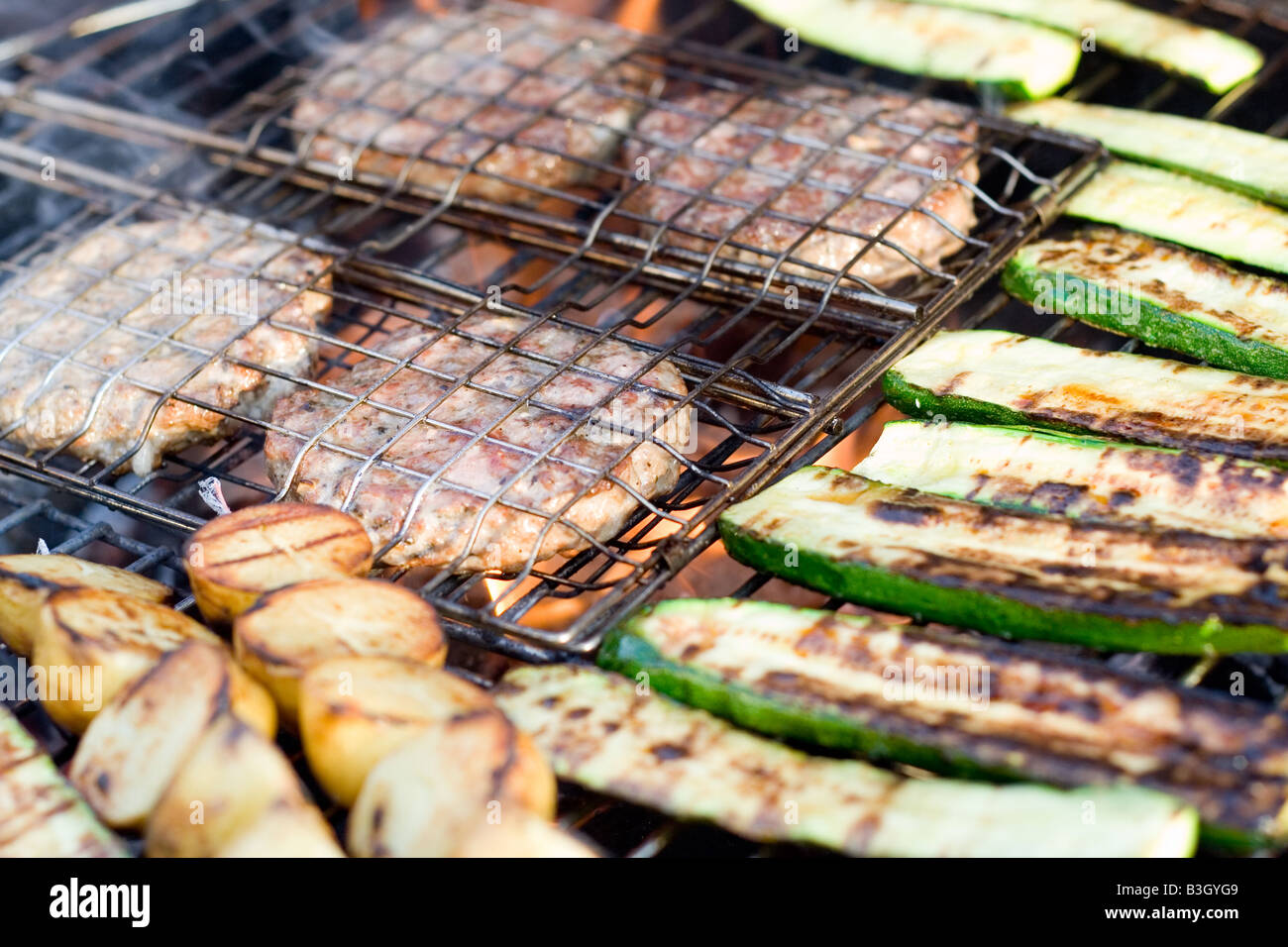 A meal cooking on a BBQ Very shallow depth of field Stock Photo - Alamy