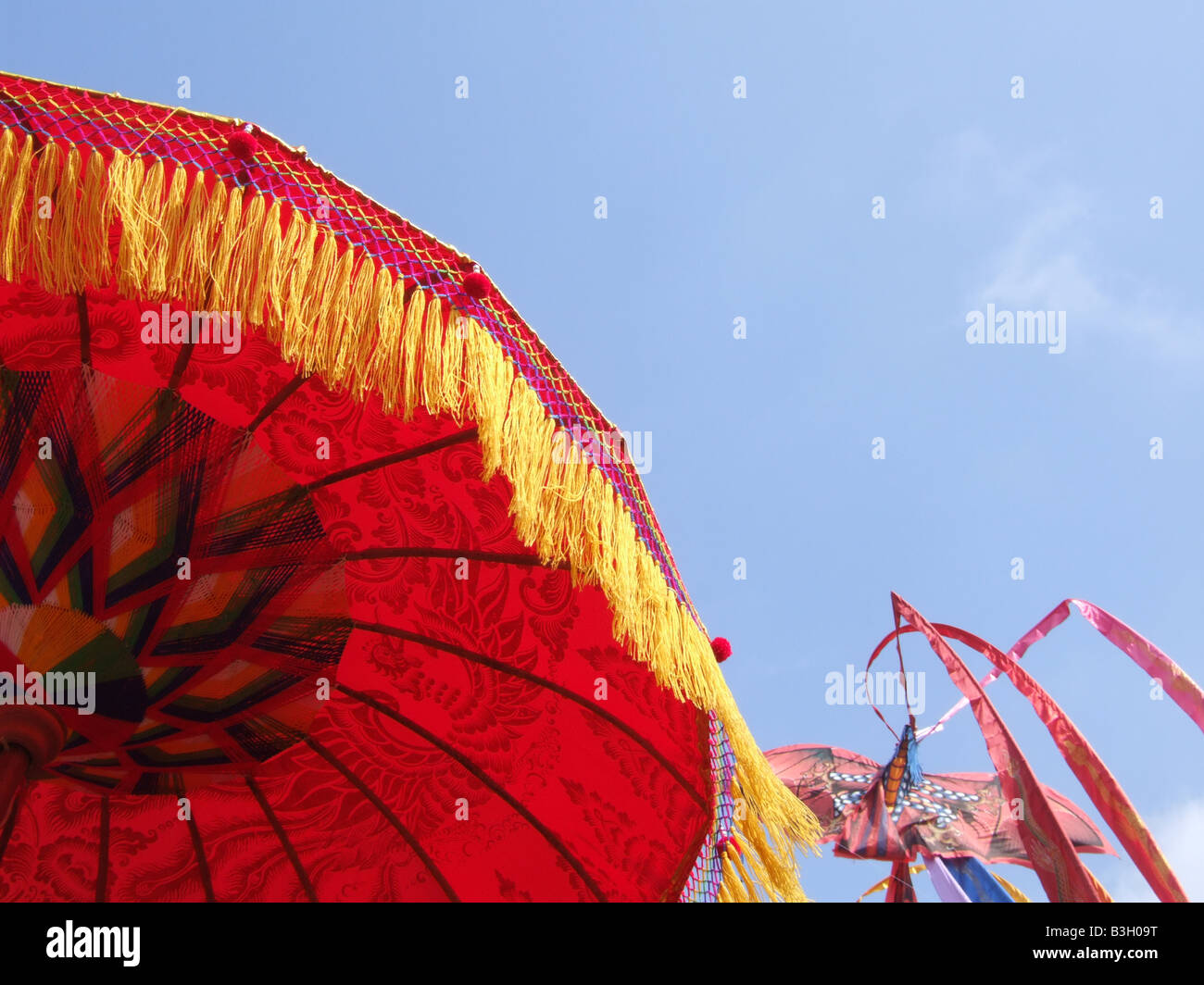 colourful parasol and garlands outside in sun Stock Photo - Alamy