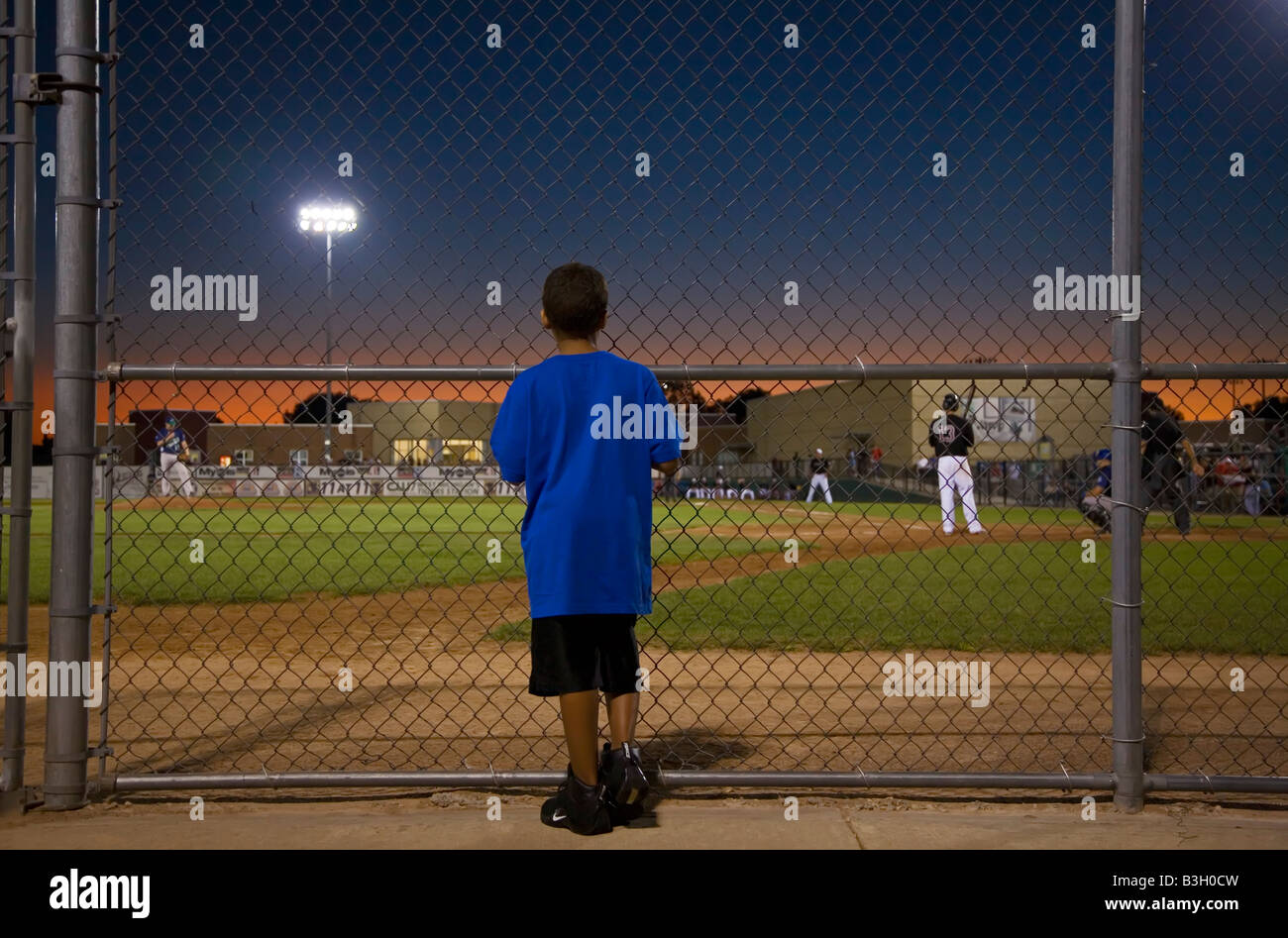 Boy Watches Minor League Baseball Game Stock Photo - Alamy