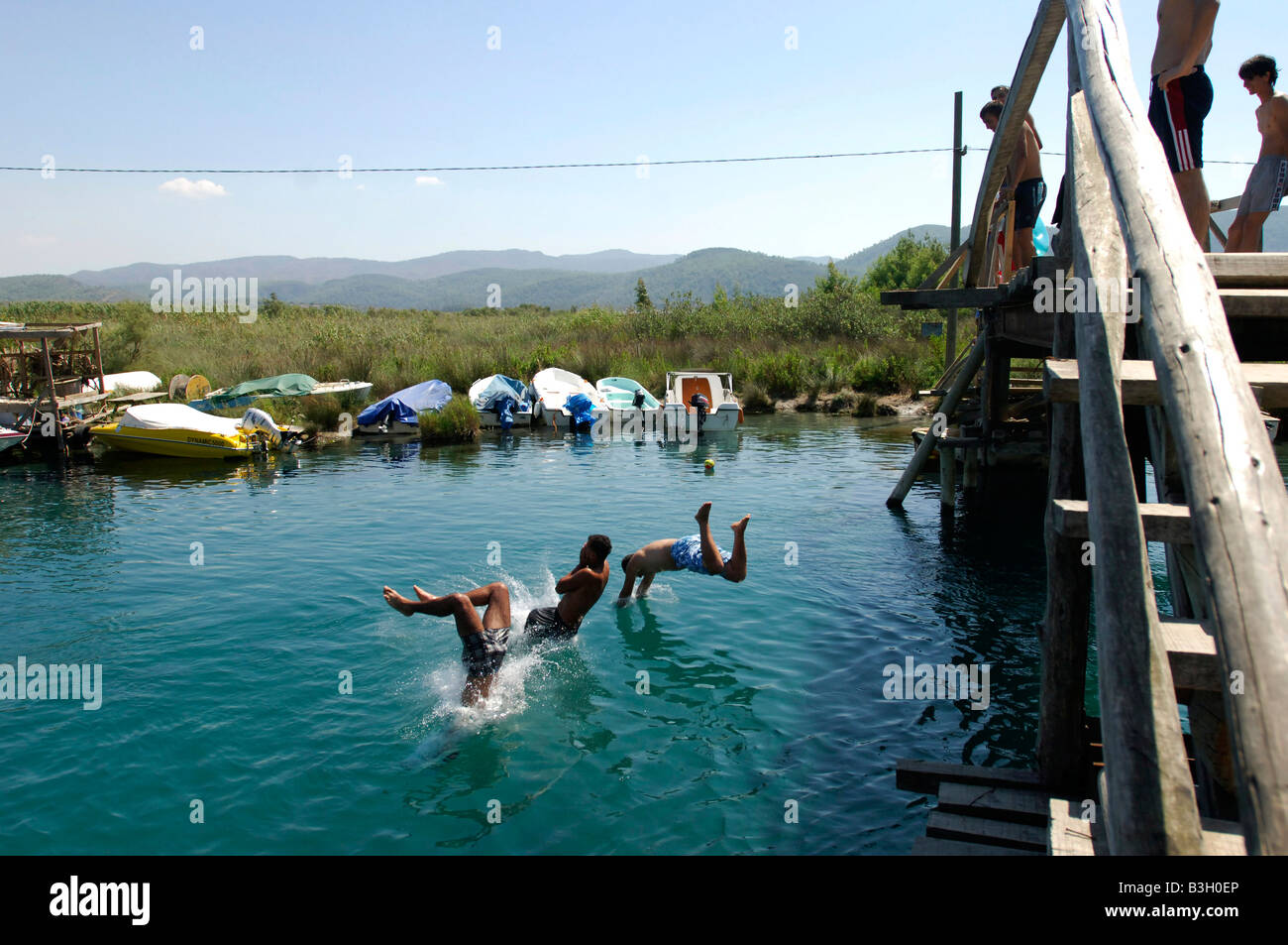 3 men jumping into a river in Turkey Stock Photo - Alamy