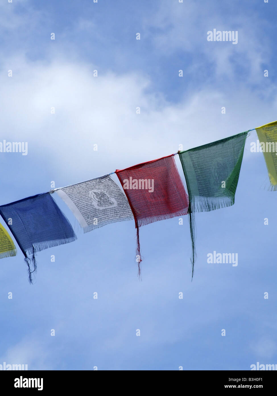 colourful buddhist prayer flags and blue sky Stock Photo - Alamy