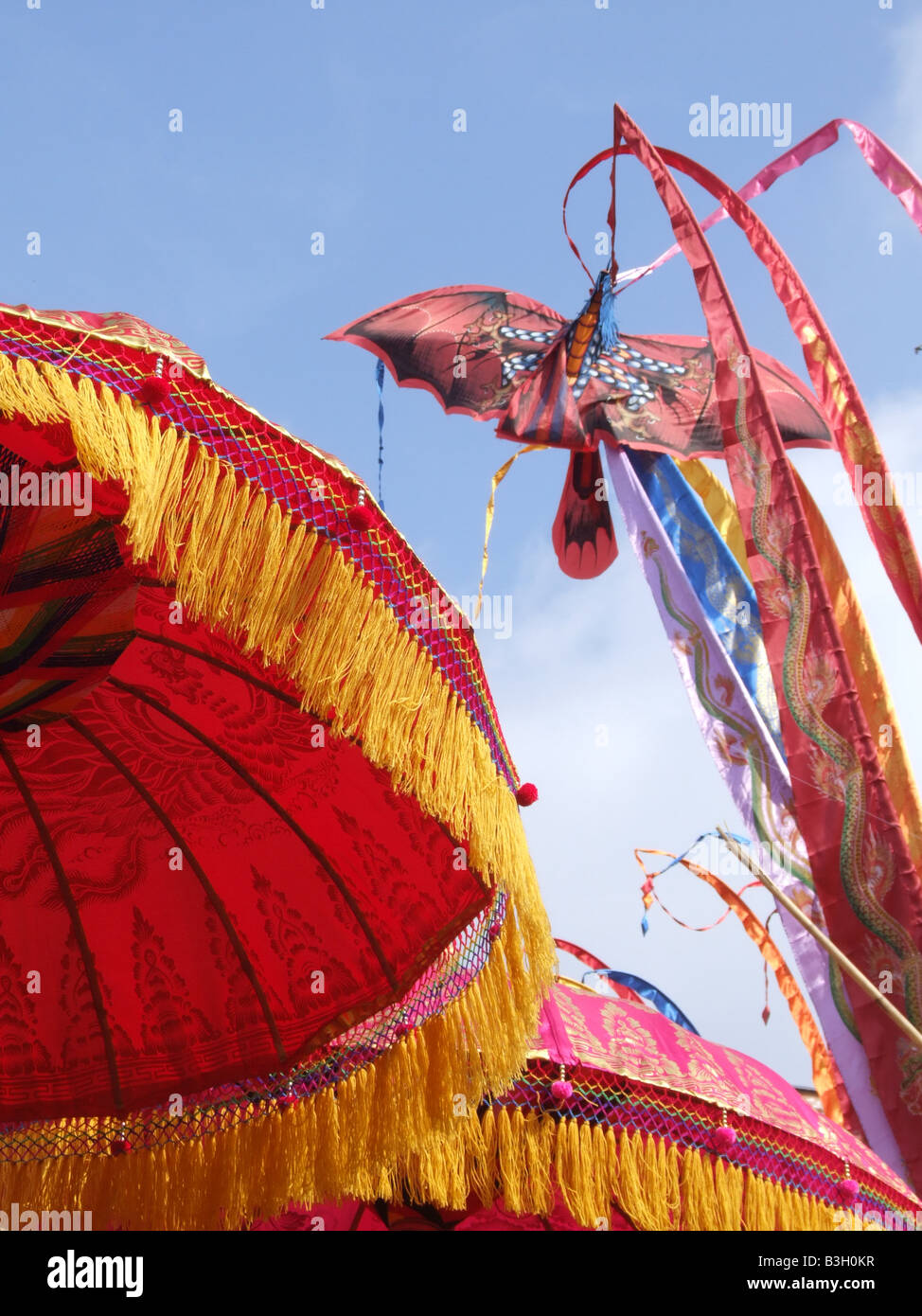 colourful parasol and garlands outside in sun Stock Photo - Alamy