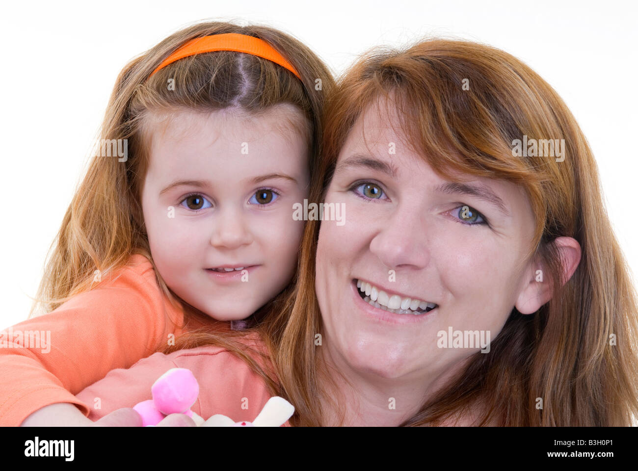 A mother with her young daughter on her back Stock Photo - Alamy