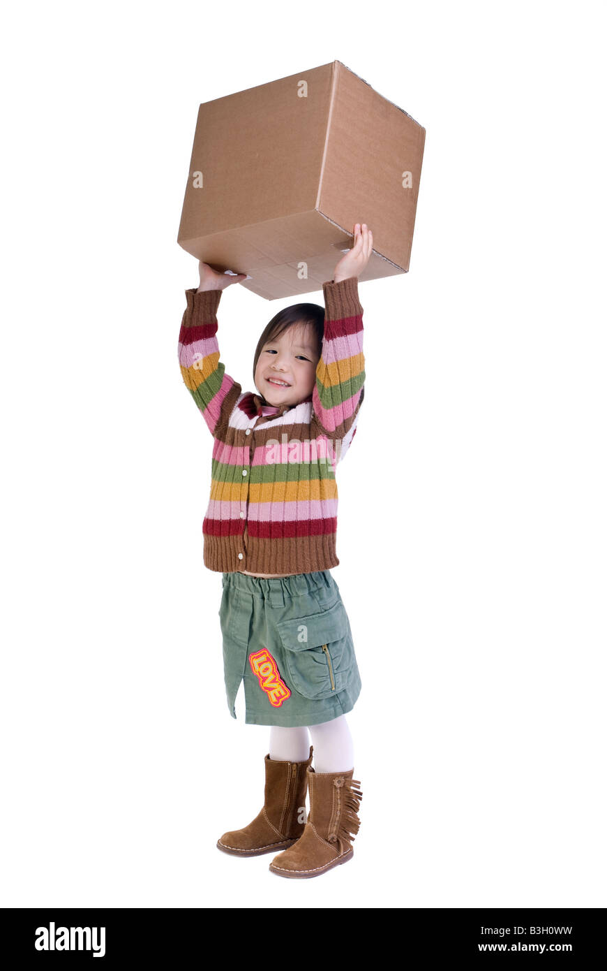 A young child packing boxes for a move Stock Photo - Alamy