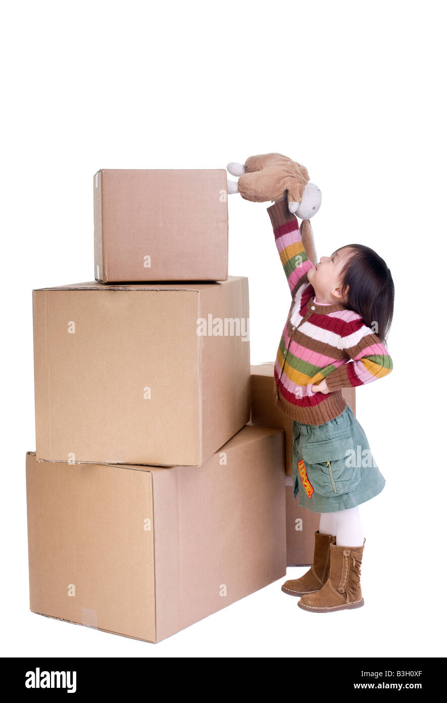 A young asian girl packing up for a move Stock Photo - Alamy