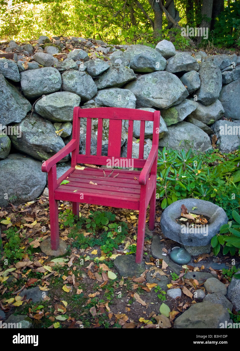 Red chair in the garden Stock Photo - Alamy