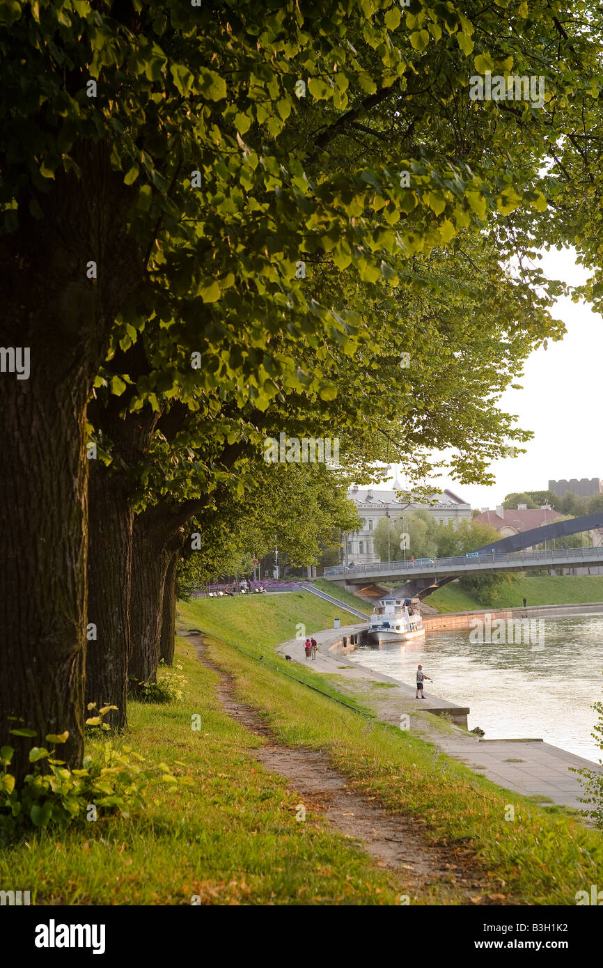Banks of the Neris river with King Mindaugas Bridge in the background ...