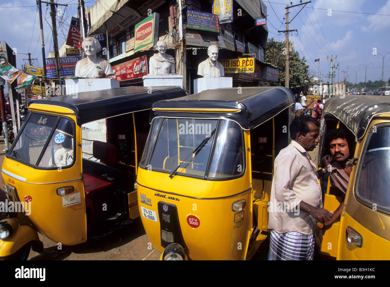 Three wheeled taxis or auto rickshaws wait for riders in Chennai Tamil ...