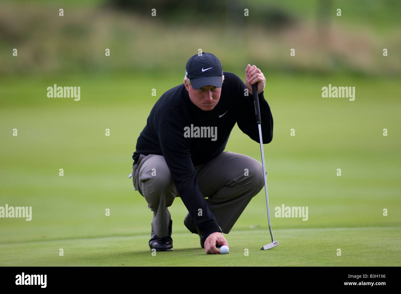GLENEAGLES SCOTLAND AUGUST 28 Richard Finch from England places his ...