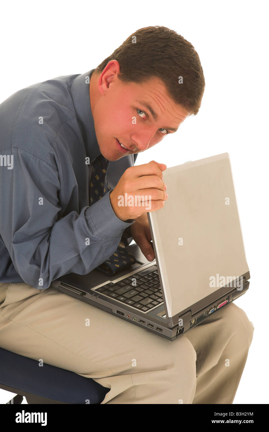 Man working on a laptop on his lap Stock Photo - Alamy