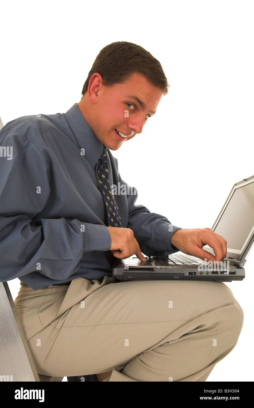 Man working with a laptop on his lap Stock Photo - Alamy