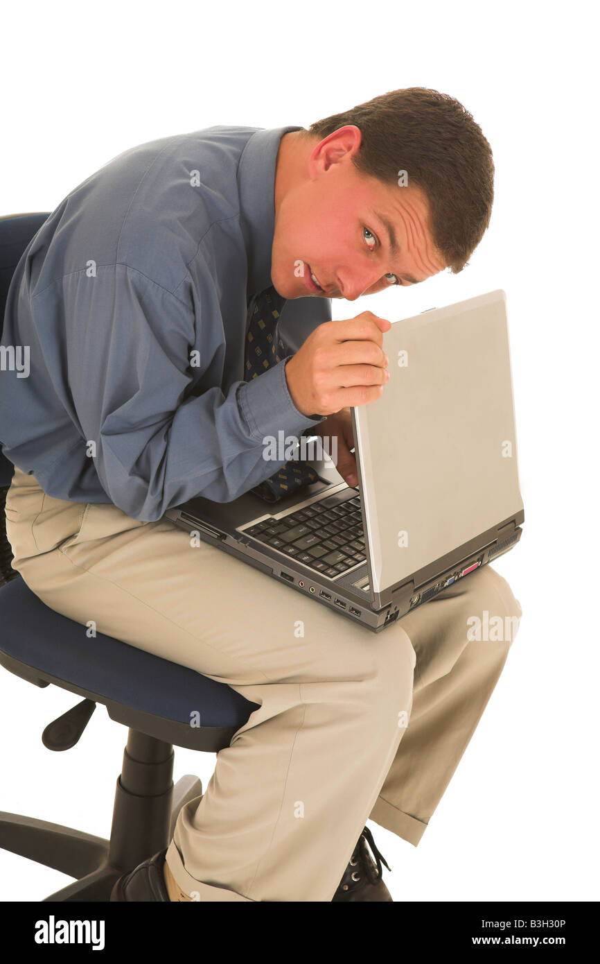 Man working on a laptop on his lap Stock Photo - Alamy