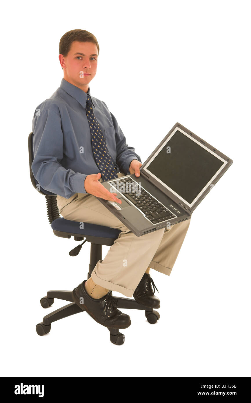 Man sitting on office chair presenting laptop Stock Photo - Alamy