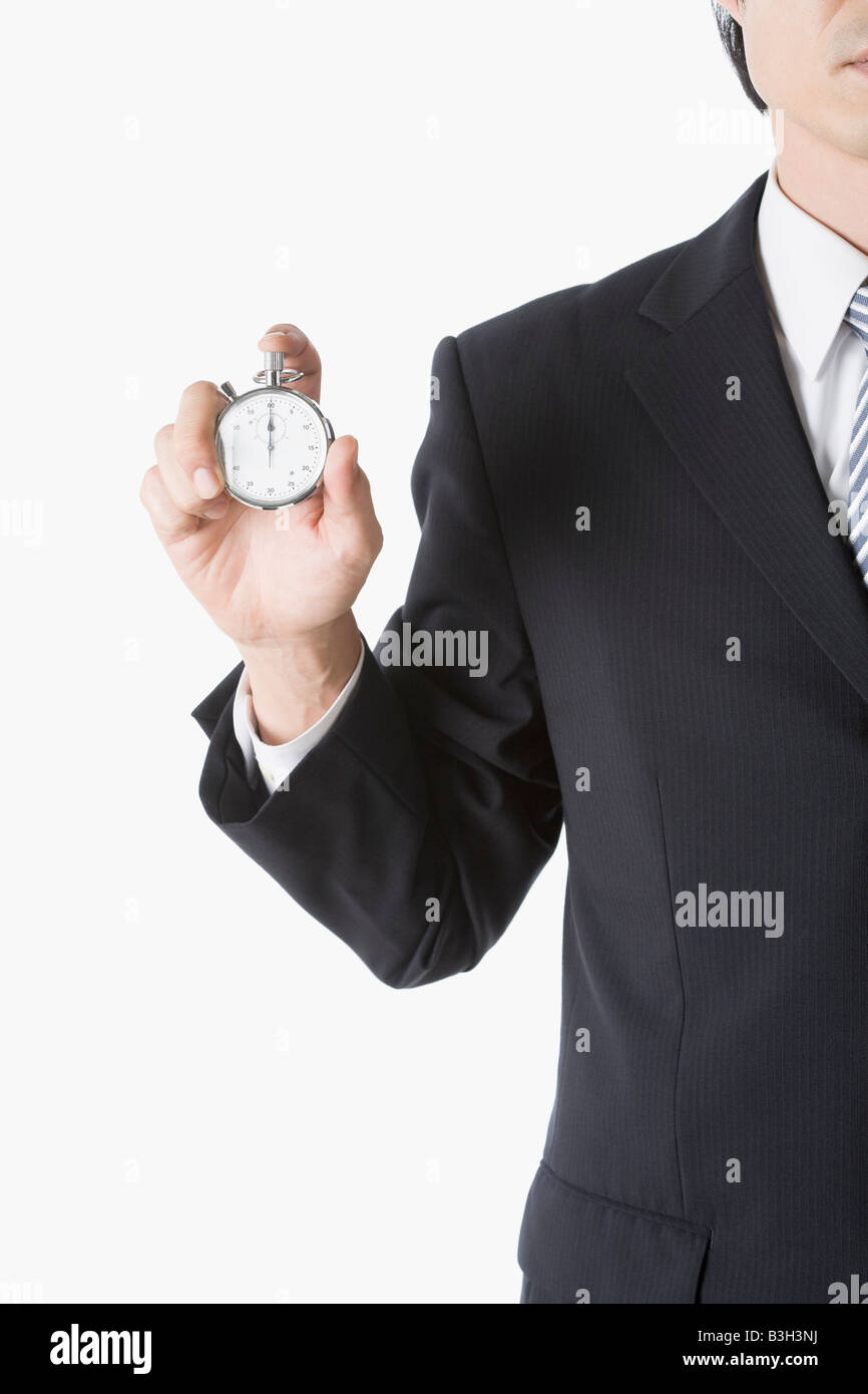 Man holding stopwatch hi-res stock photography and images - Alamy