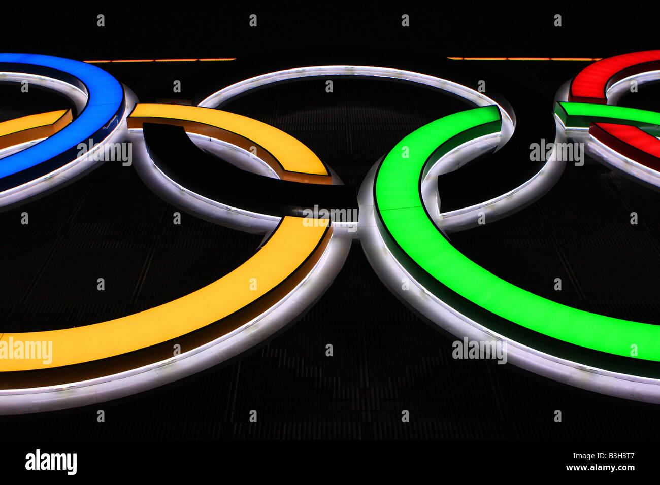 Olympic rings in neon lights on the side of a building in Hong Kong ...