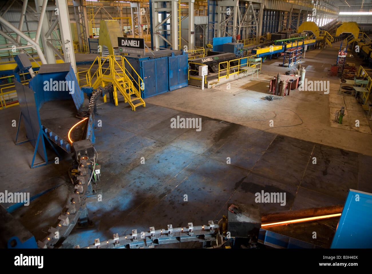 Molten steel on production line to create steel rebar at EISF Steel ...