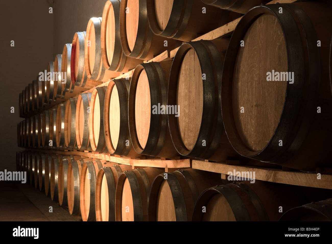 Stacked Oak barrels for maturing red wine and brandy Stock Photo - Alamy