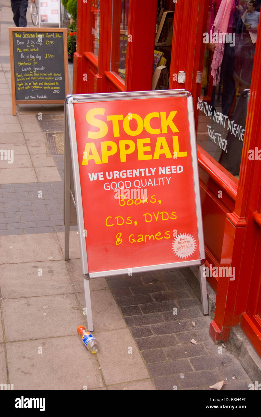 Sign outside charity shop requesting people to bring them more stock ...