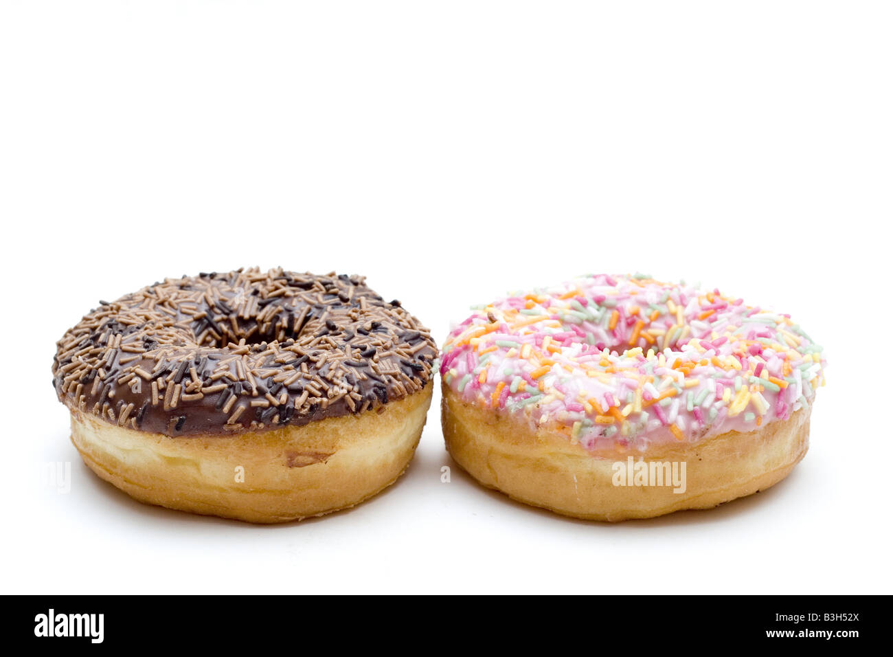 Two doughnuts side by side isolated on white Stock Photo - Alamy