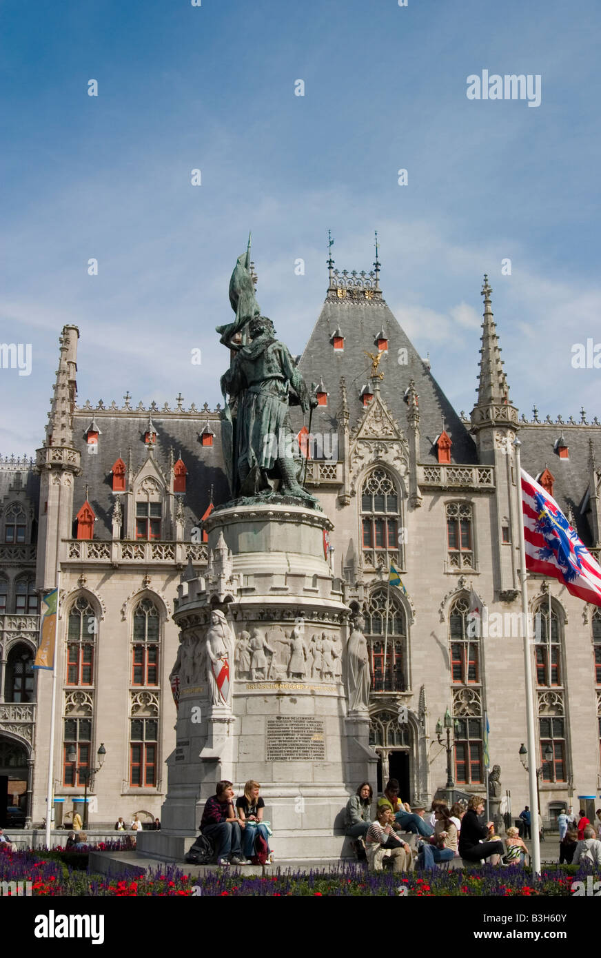 Bruges, sightseers by monument outside Provincial Court building in the ...