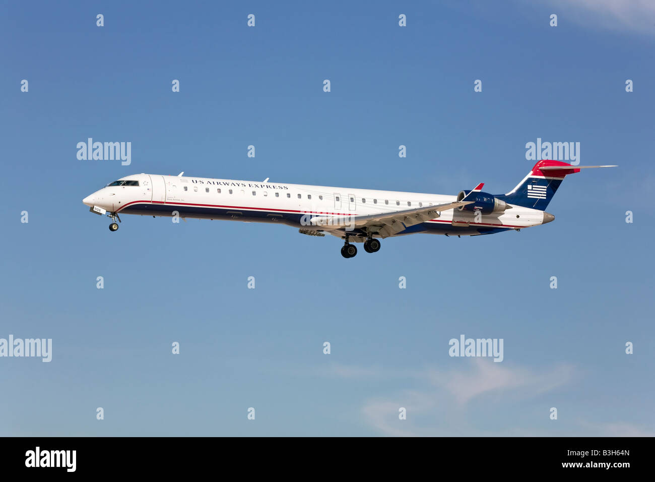 A US Airways Express Bombadier on finals at LAX Stock Photo - Alamy