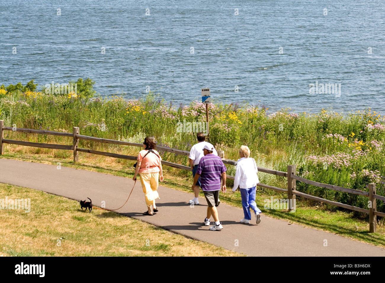 Walkers enjoying a stroll along the Lake Phalen Park shoreline. St Paul ...