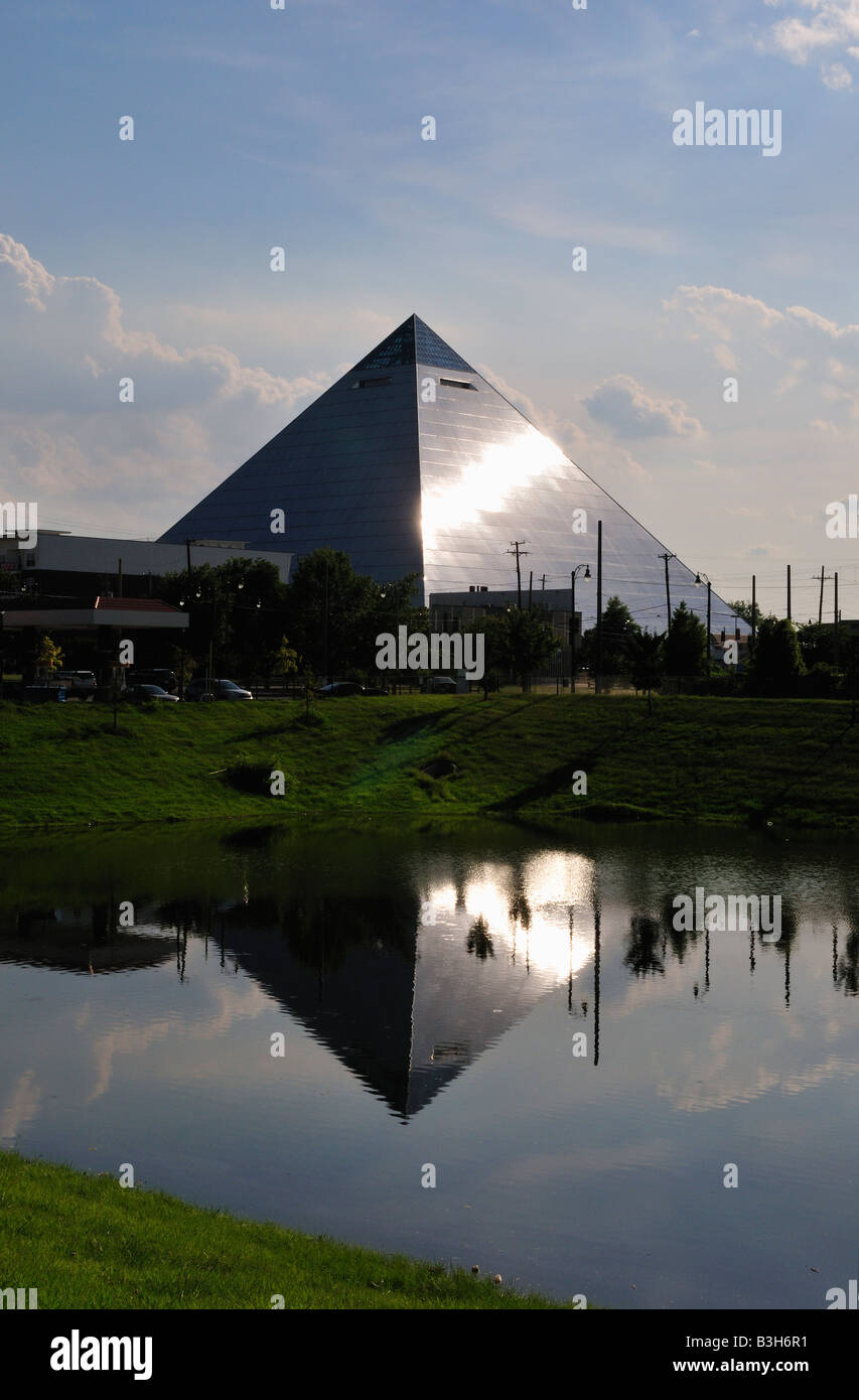 Reflection of the Pyramid Arena in a pond on a sunny summer evening in ...