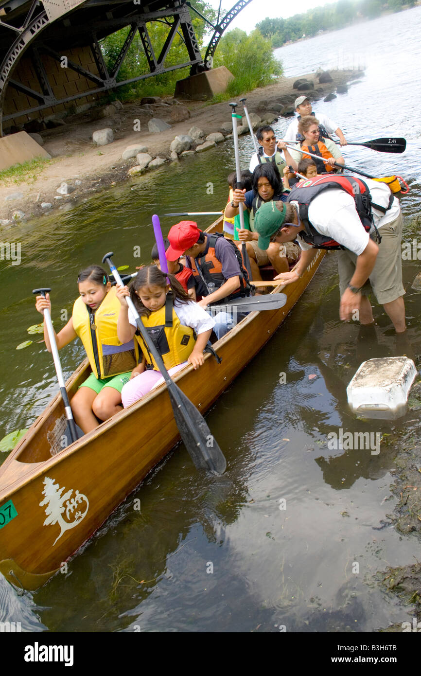 Leader pushes canoe packed with kids and adults may be their first ride ...