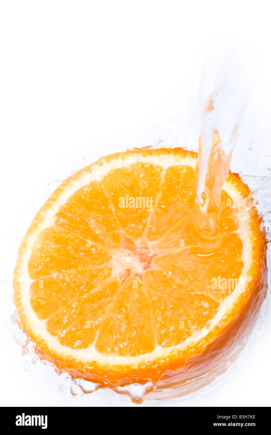 Water splashing on a fresh cut orange Stock Photo - Alamy
