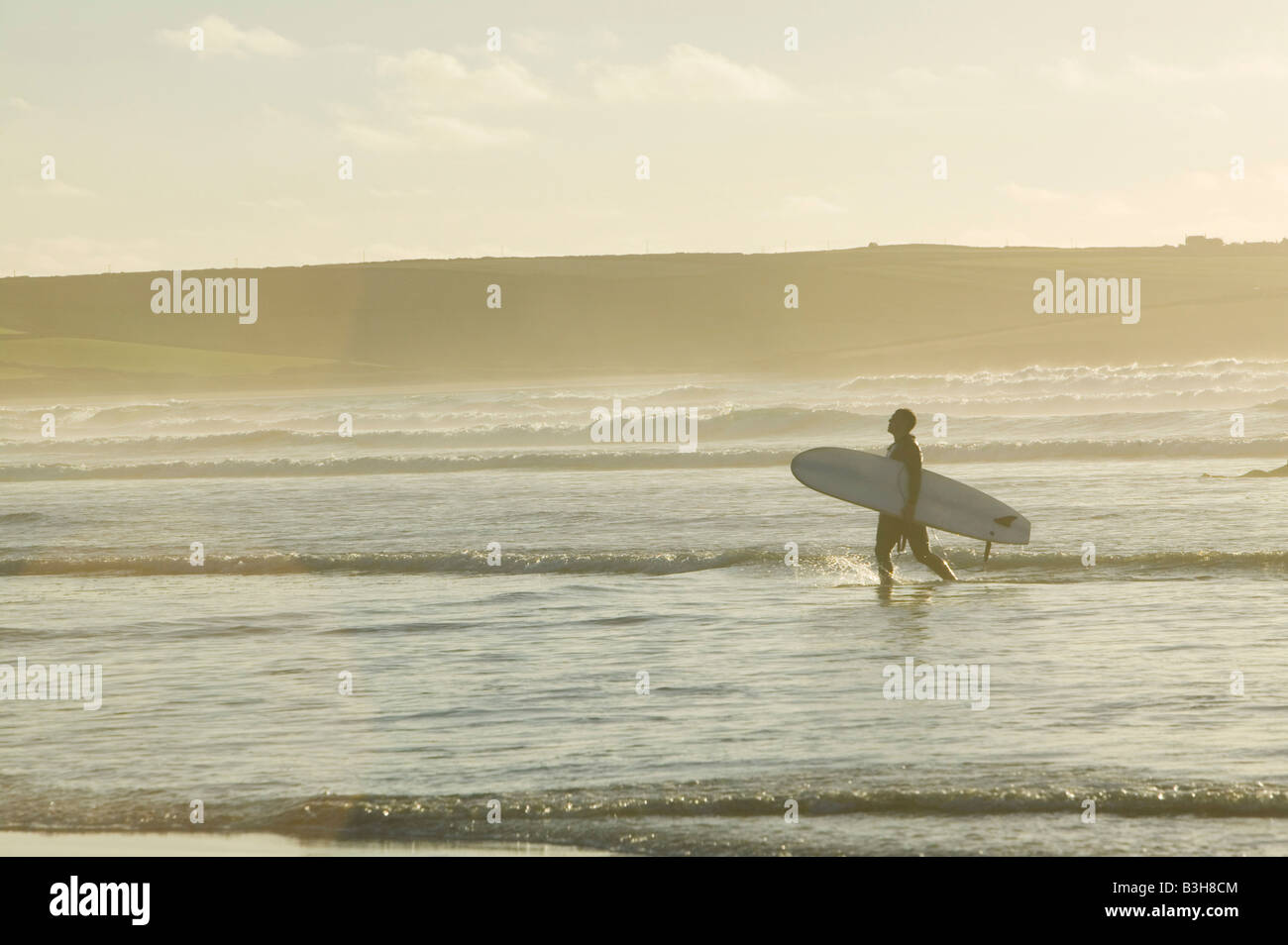 Surfers in Hayle Bay Polzeath Cornwall UK Stock Photo - Alamy