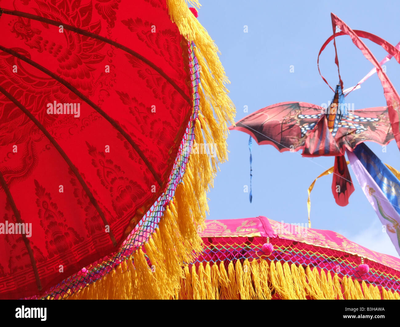 colourful parasol and garlands outside in sun Stock Photo - Alamy