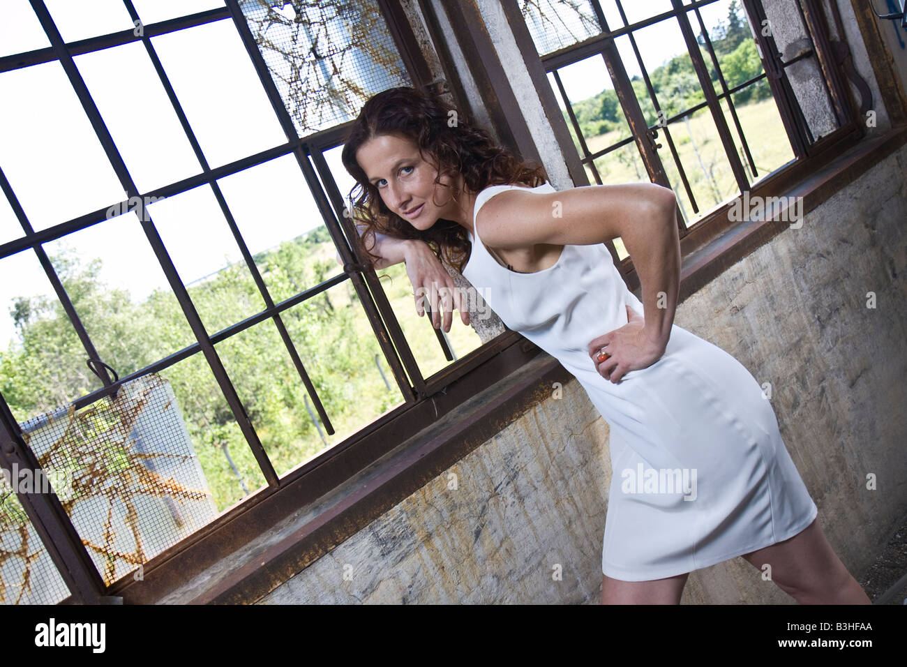 young woman posing at window Stock Photo - Alamy