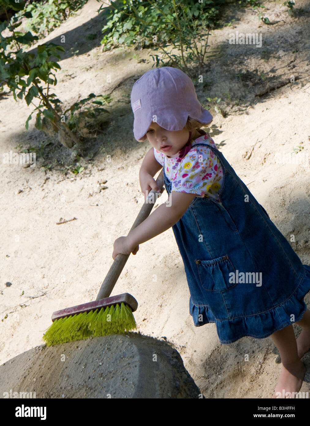 Child playing broom hi-res stock photography and images - Alamy