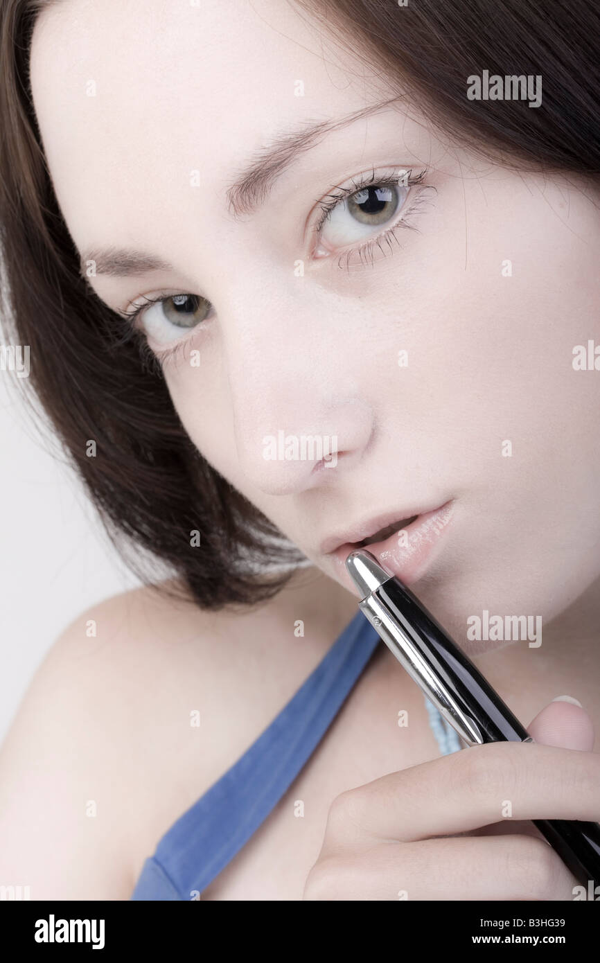 young woman with pen Stock Photo - Alamy