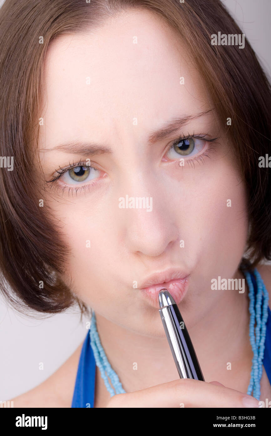 young woman with pen Stock Photo - Alamy