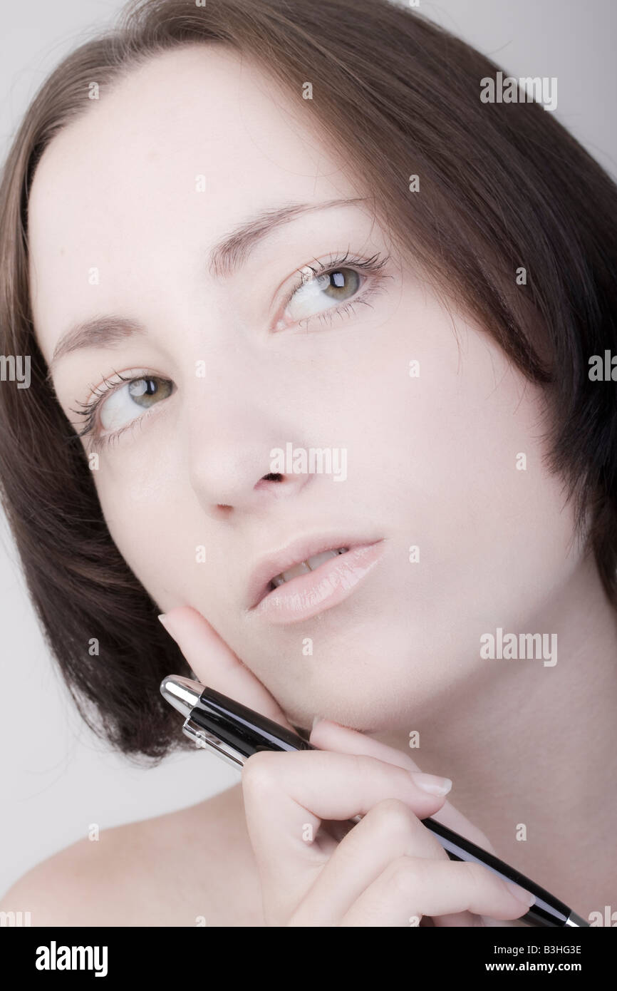 young woman with pen Stock Photo - Alamy